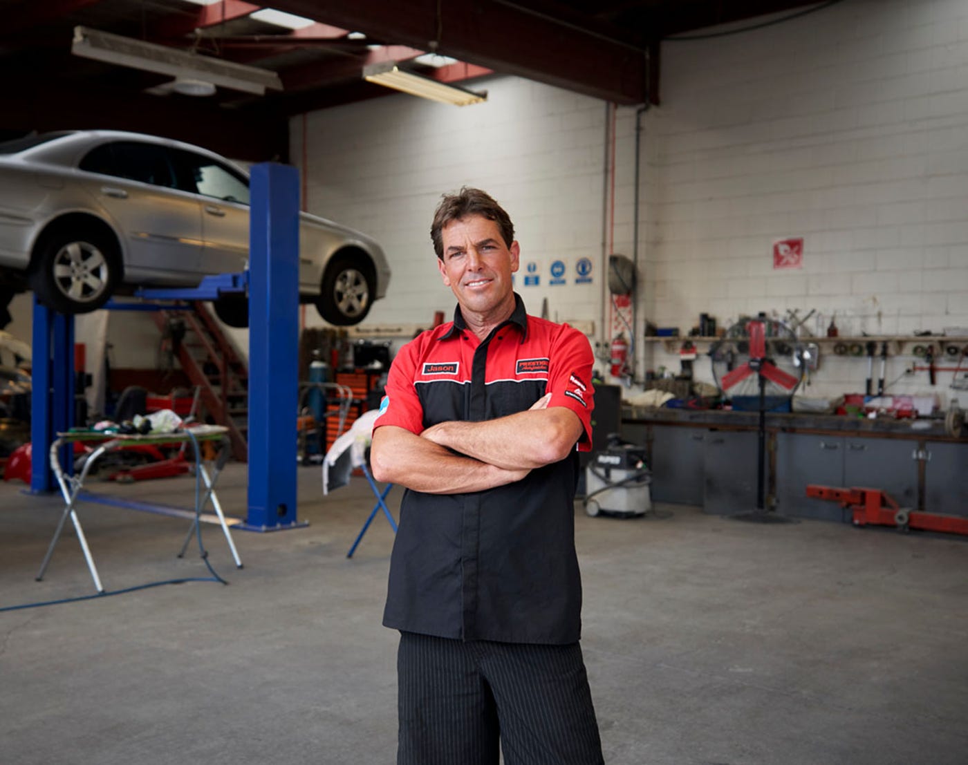 Automotive business owner in workshop