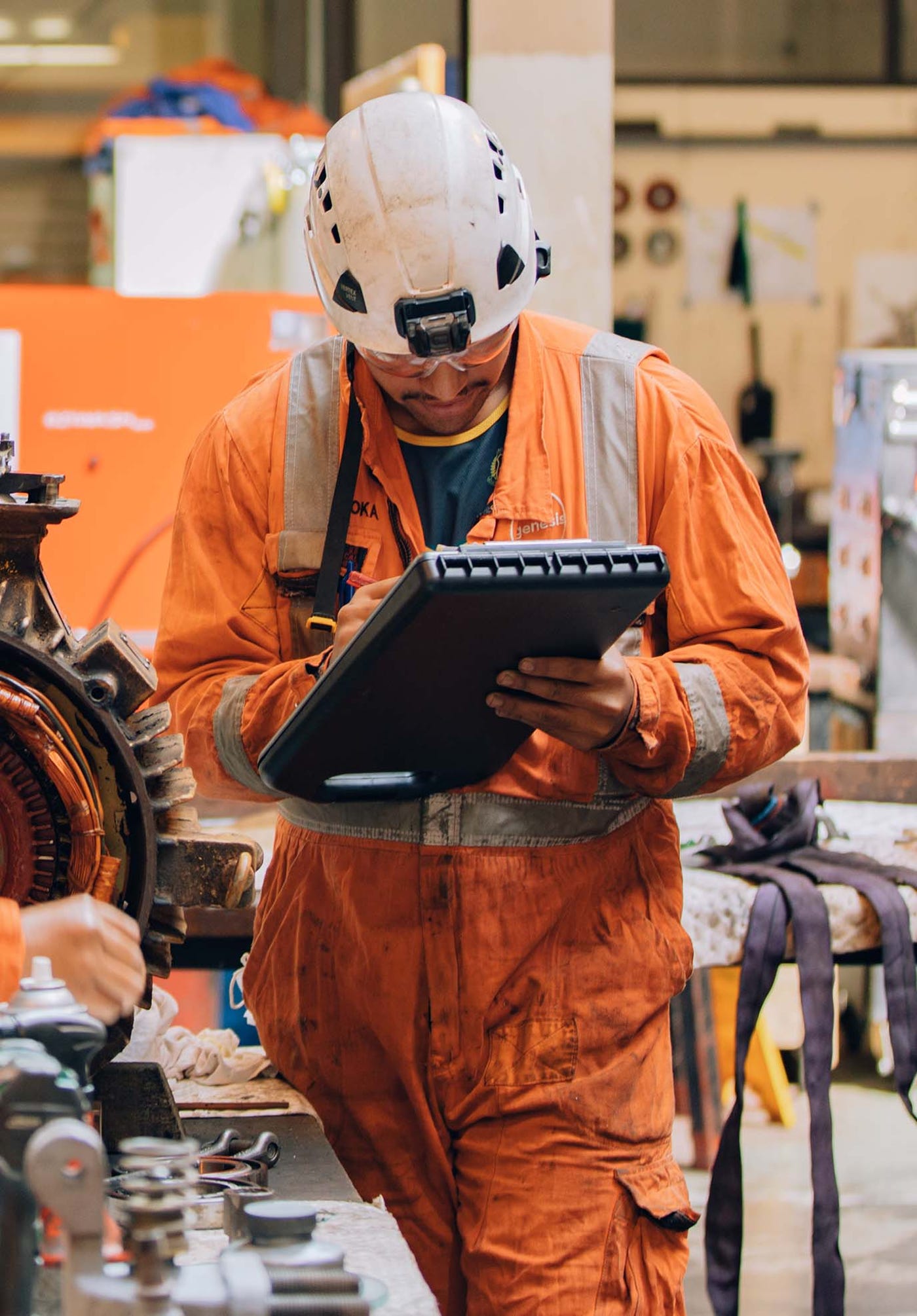 employee checking notes at huntly power station