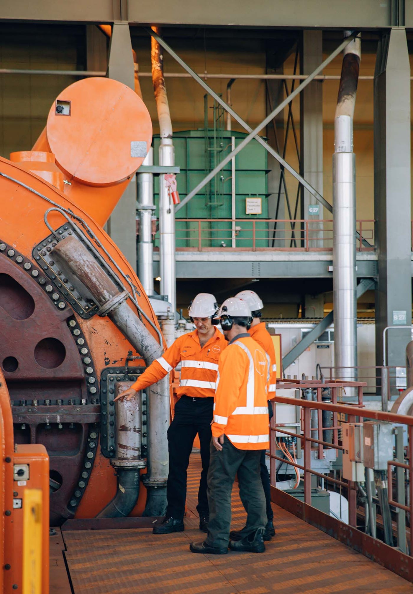 Genesis employees standing by a Huntly generator